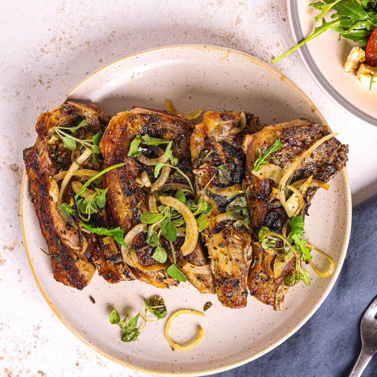 Oregano Lamb Cutlets with Feta, Rocket & Tomato Salad Recipe | Woolworths